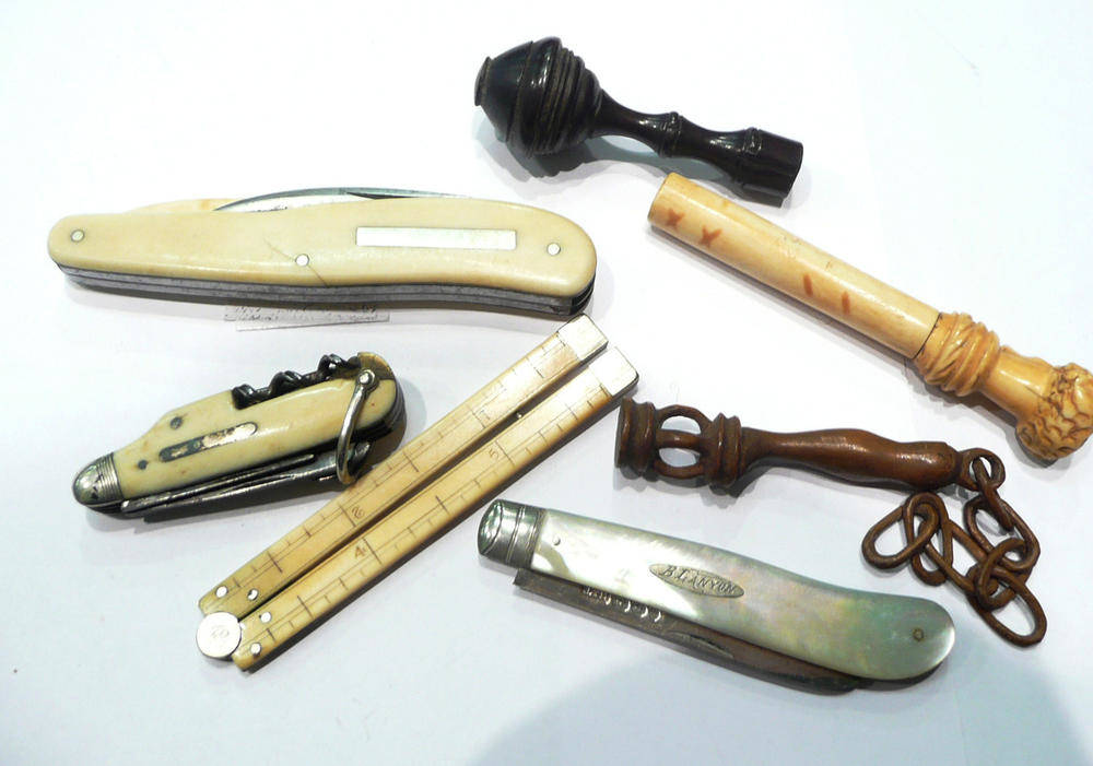 Lot 222 - A treen pipe stamper in the form of a leg,