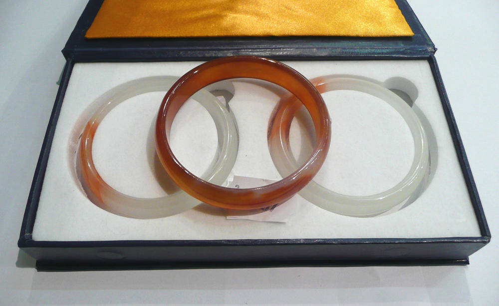 Lot 736 - Three jade bangles