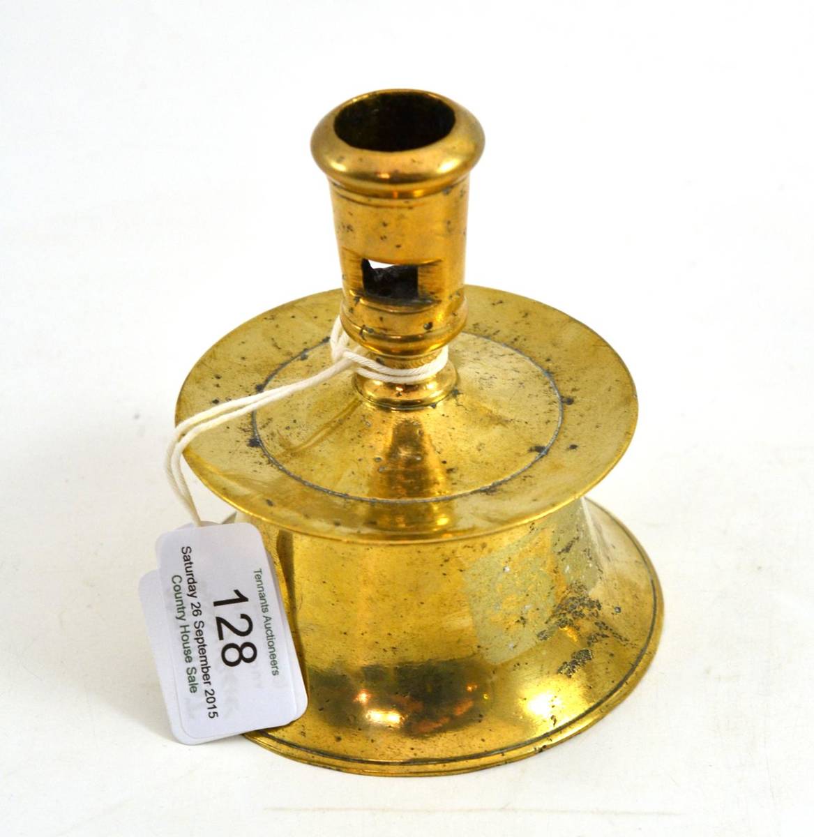 Lot 128 - A 16th century brass capstan candlestick,