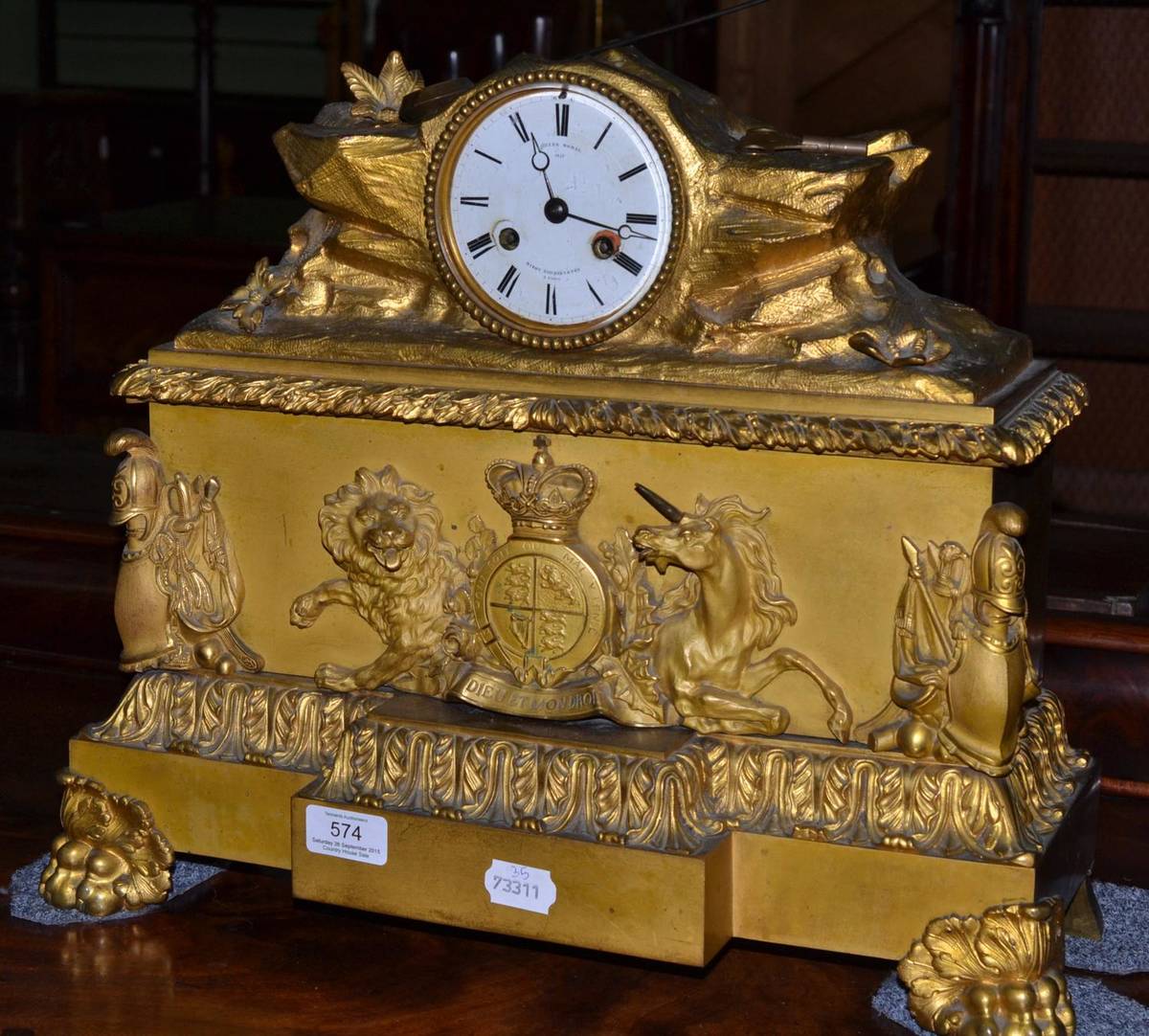 Lot 574 - A gilt metal striking mantel clock, retailed