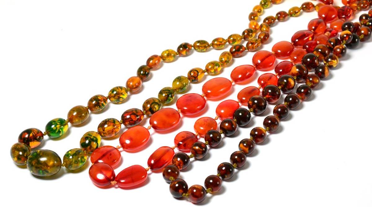 Lot 253 - Three amber necklaces, probably pressed