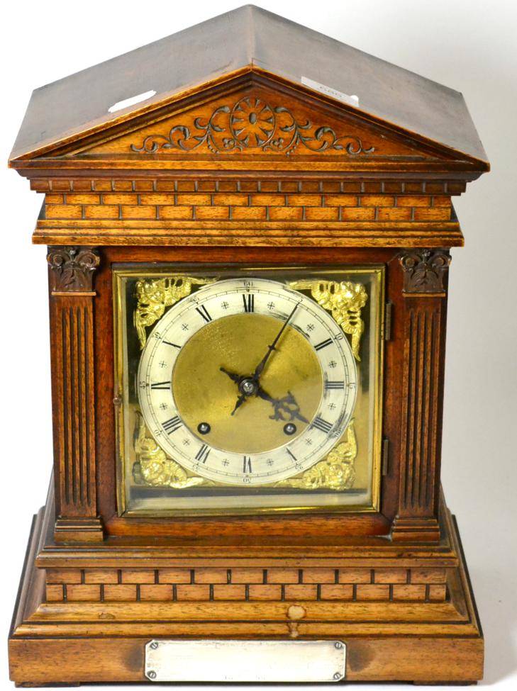 Lot 686 - ~ A walnut quarter striking table clock,